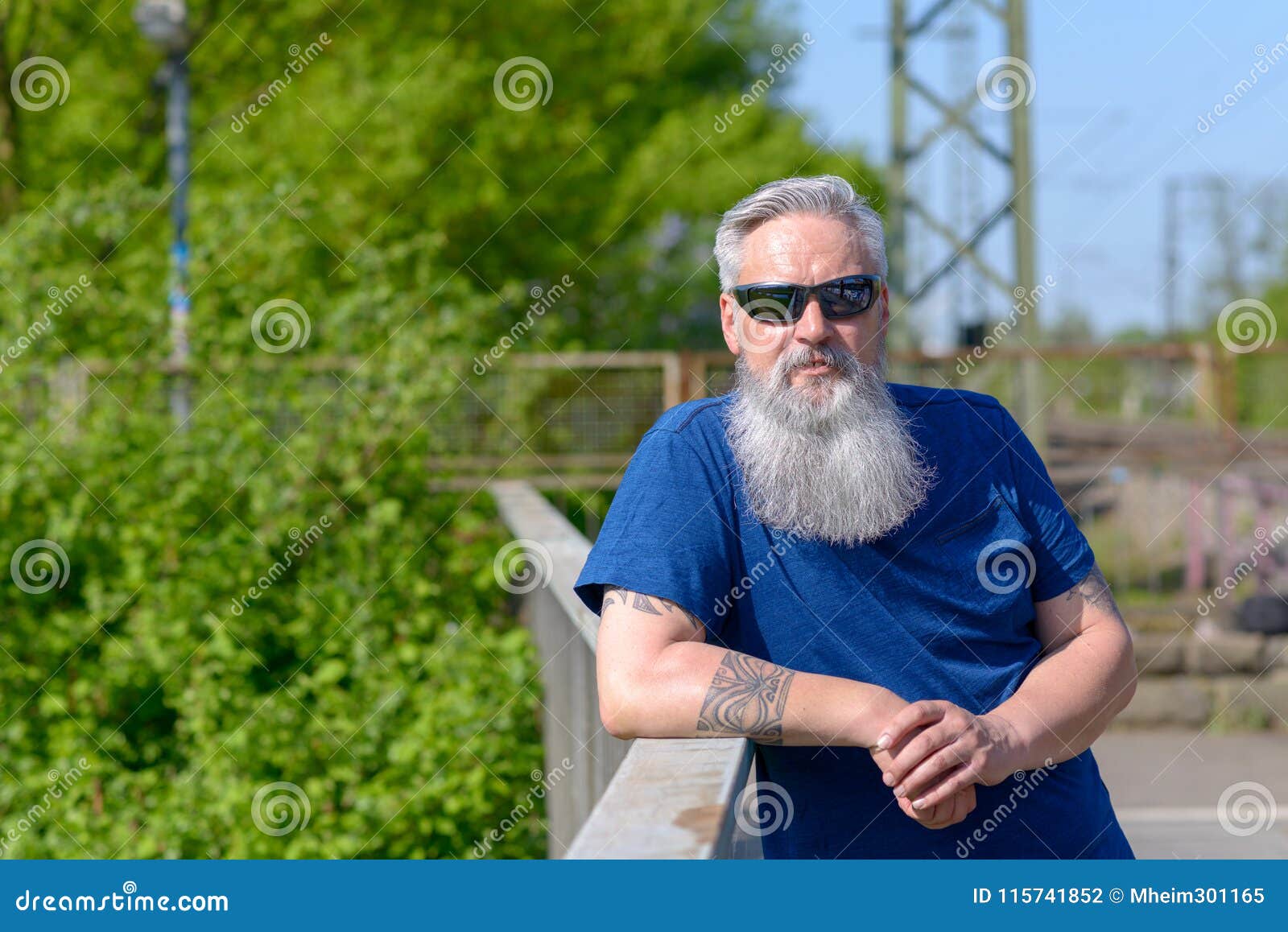 Relaxed Bearded Man Standing on a Bridge Stock Photo - Image of aged ...