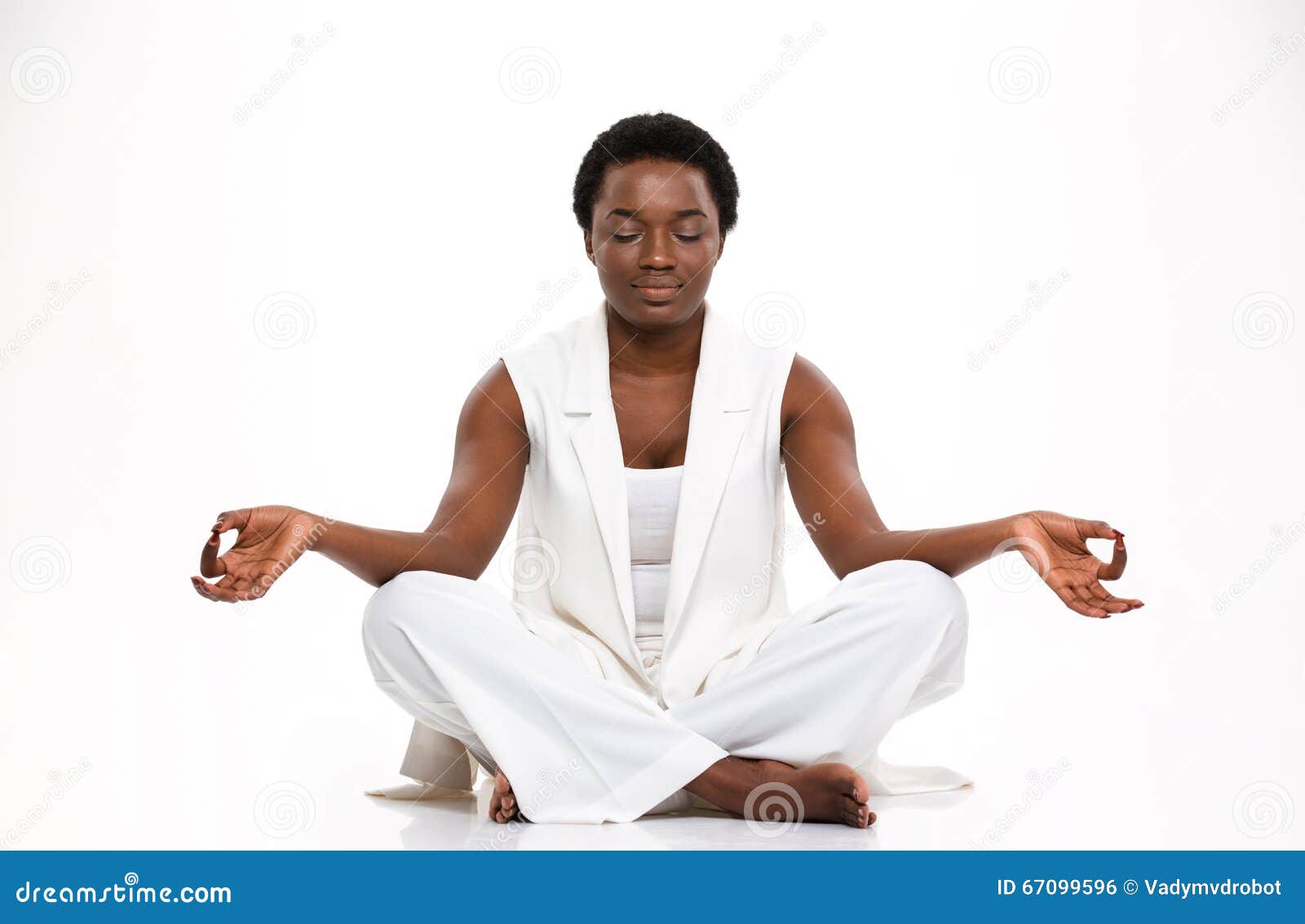Relaxed Beautiful African Woman Sitting And Meditating In Yoga Pose