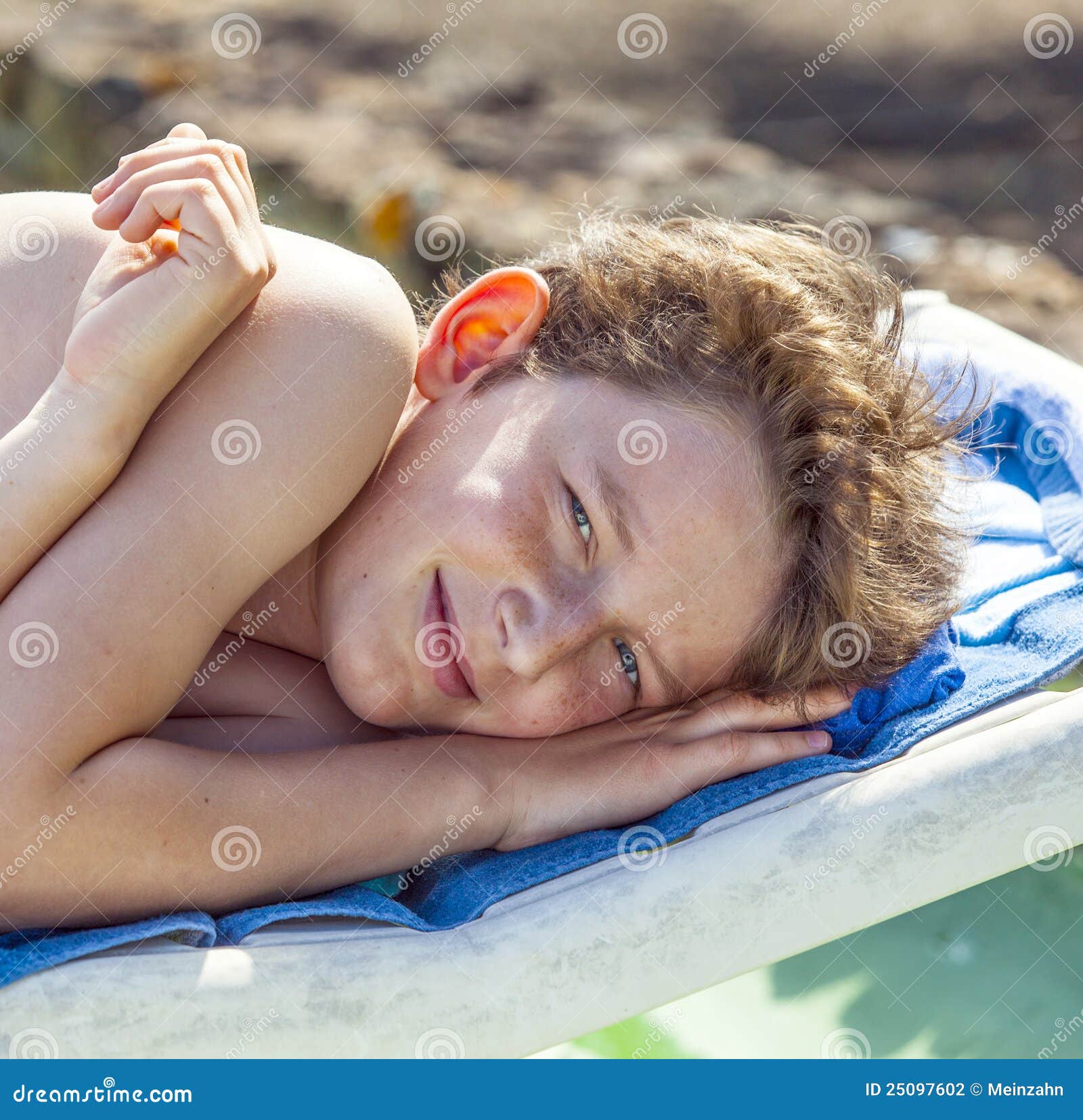 Relaxed Boy Enjoys Lying on a Beach Lounger Stock Photo - Image of ...