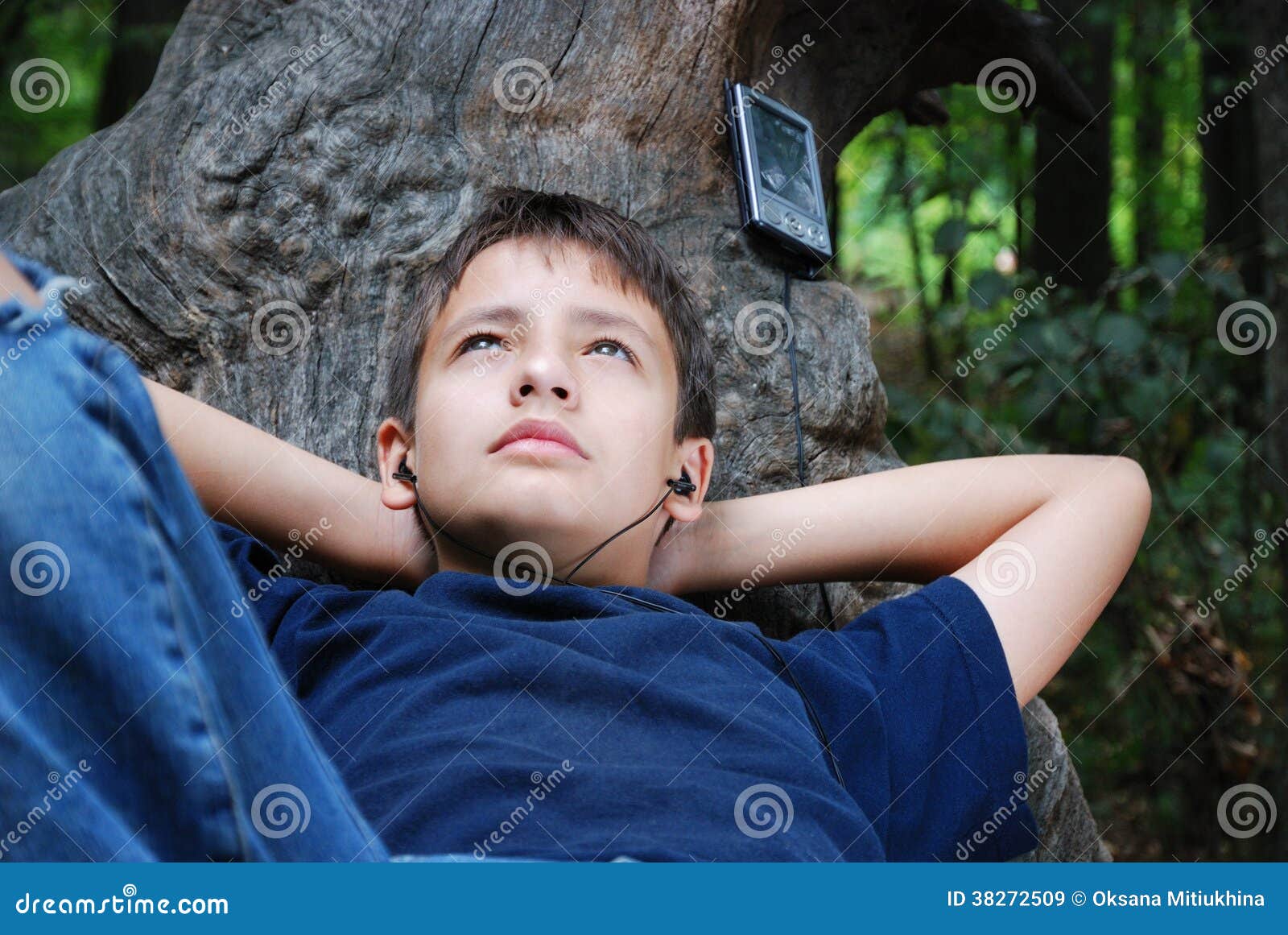 Relaxed boy with a gadget stock image. Image of teenager - 38272509