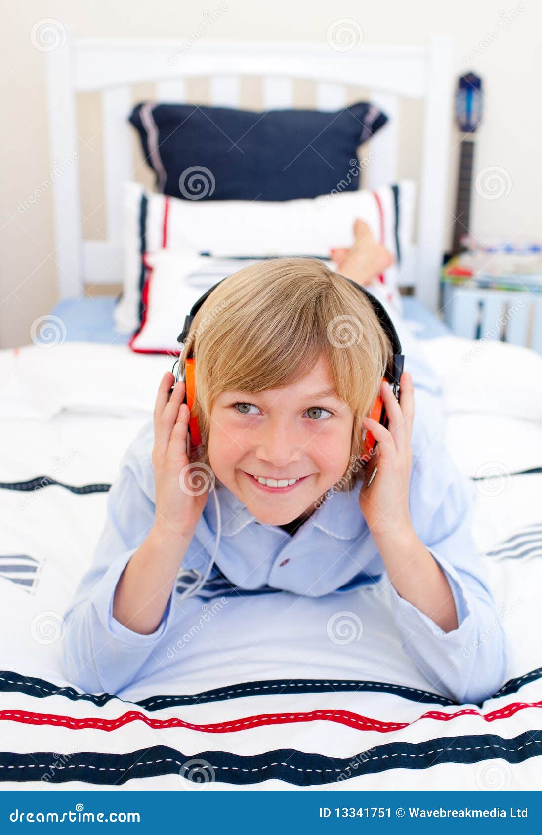 Relaxed Boy Listening Music Lying Down on Bed Stock Image - Image of ...