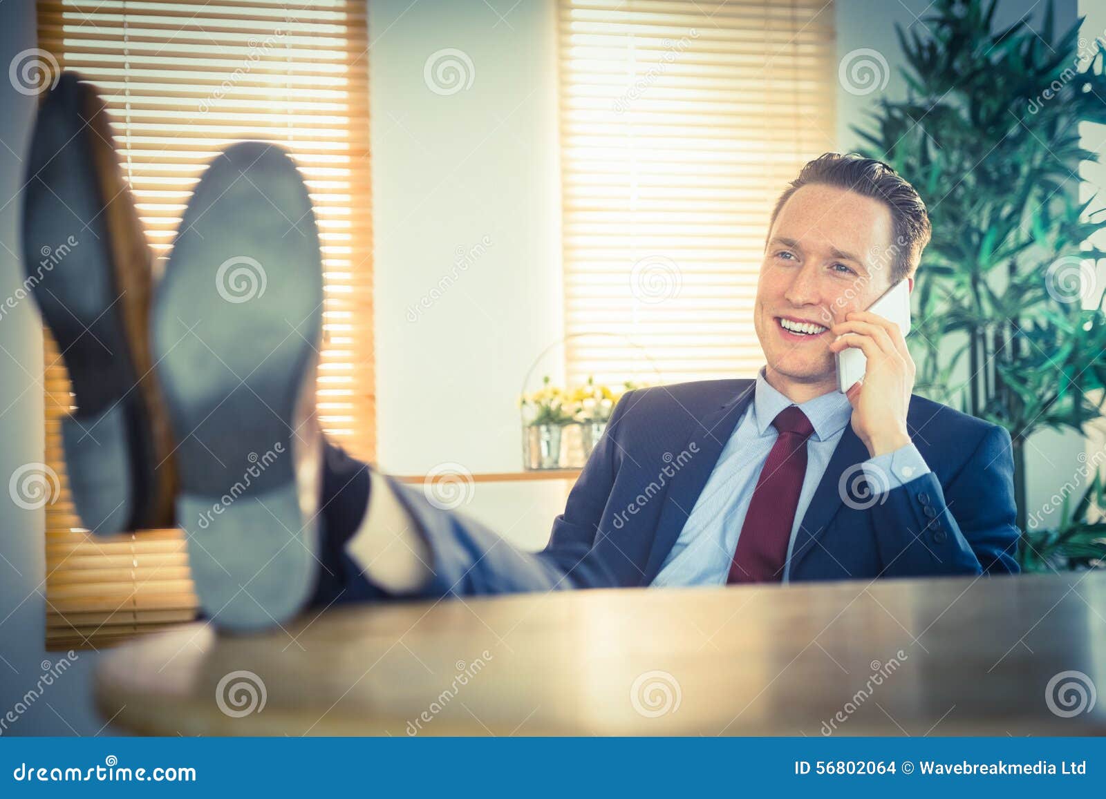 Relaxed Businessman Making a Phone Call Stock Photo - Image of person ...