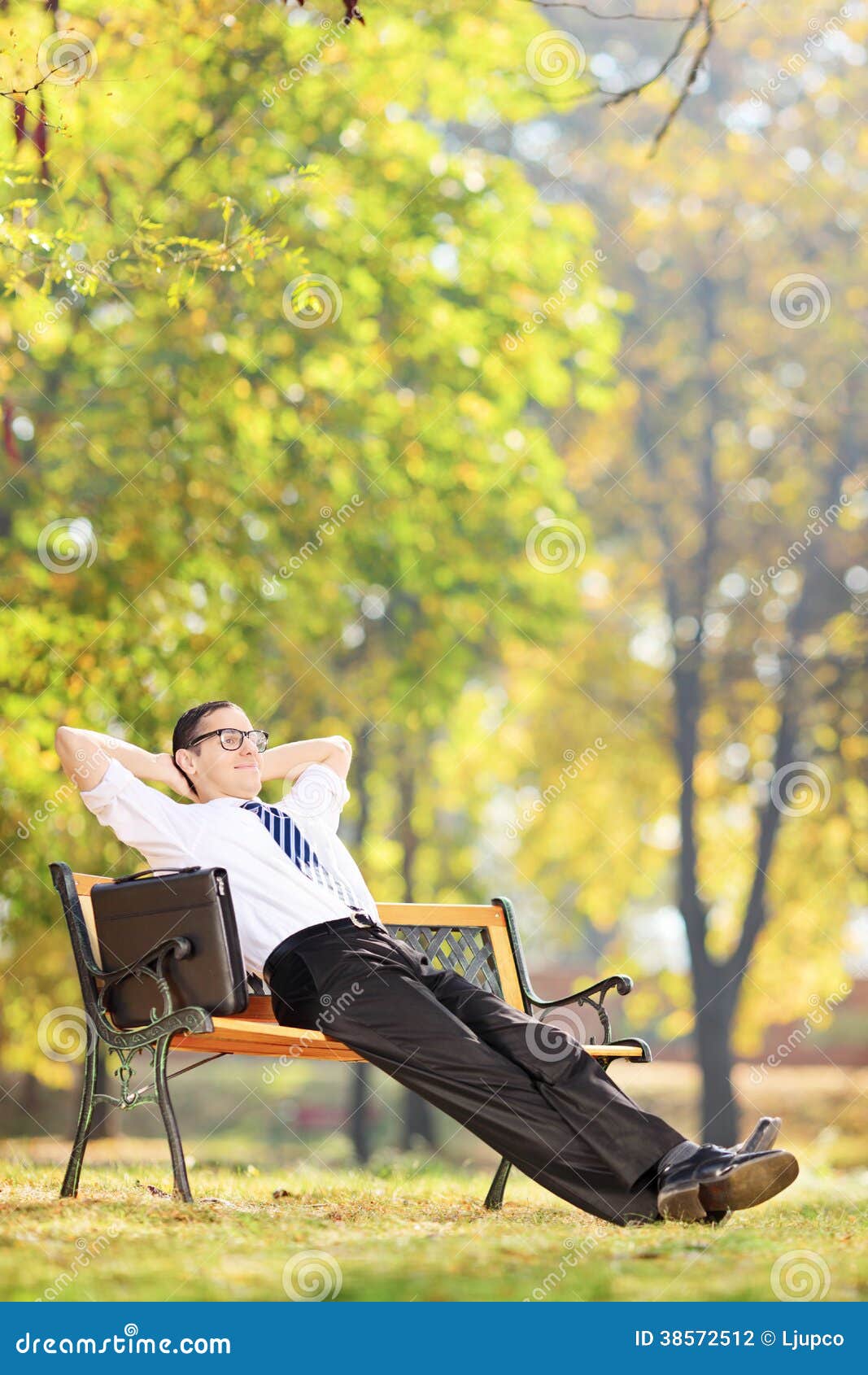 Relaxed Businessman Sitting on a Bench in Park Stock Photo - Image of ...