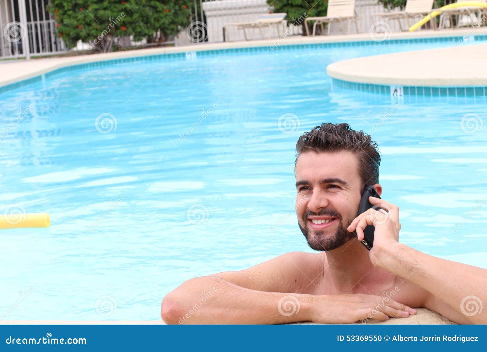 Relaxed Businessman Using Phone by Swimming Pool Stock Photo - Image of ...