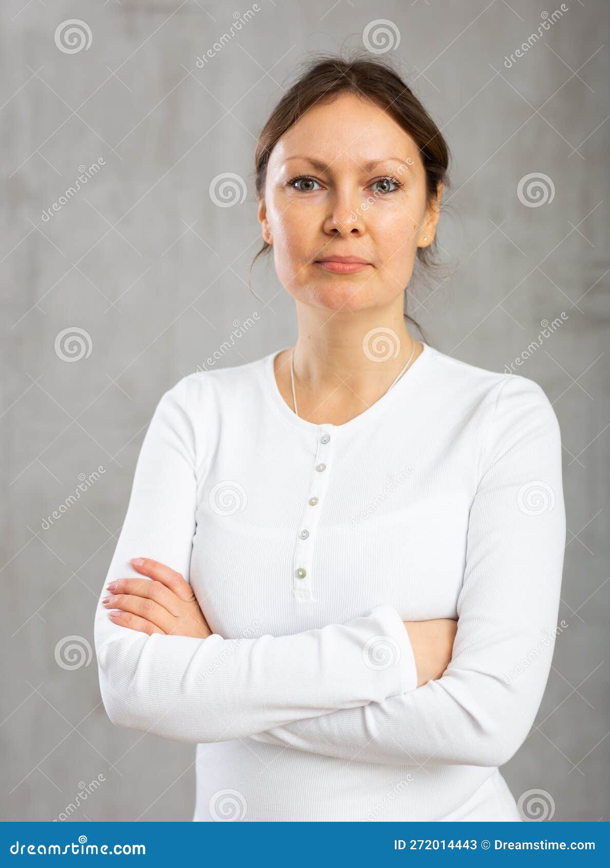 Relaxed Calm Woman Standing and Looking Forward in Front of Her Stock ...