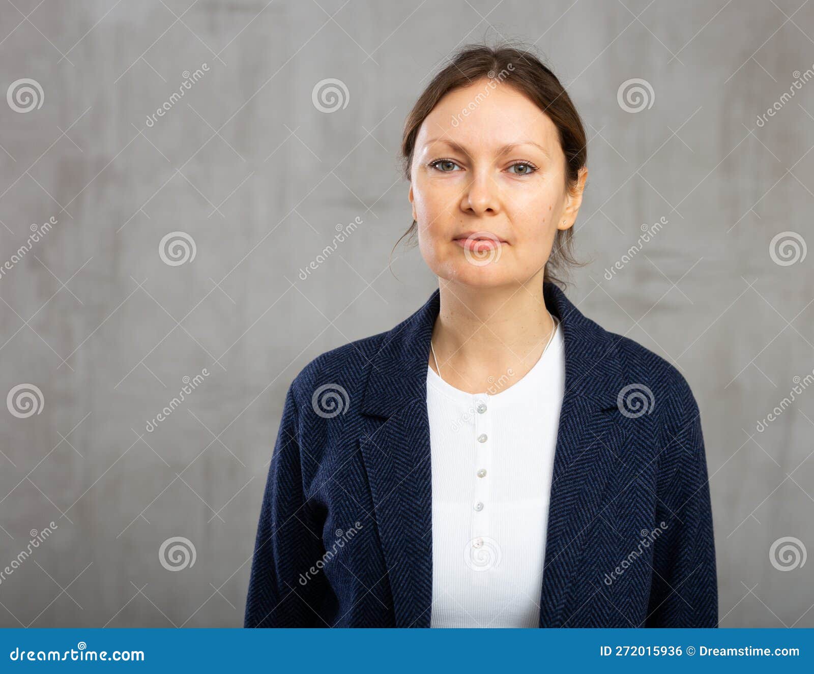 Relaxed Calm Woman Standing and Looking Forward in Front of Her Stock ...