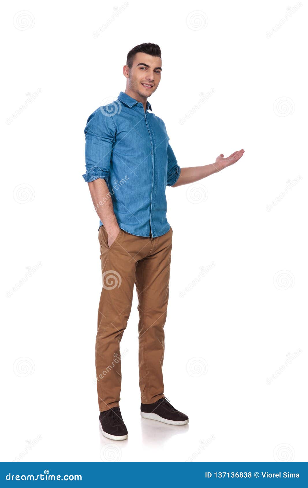 Relaxed Casual Man Standing and Presenting To Side Stock Photo - Image ... Relaxed Casual Man Standing and Presenting To Side Stock Photo - Image ...