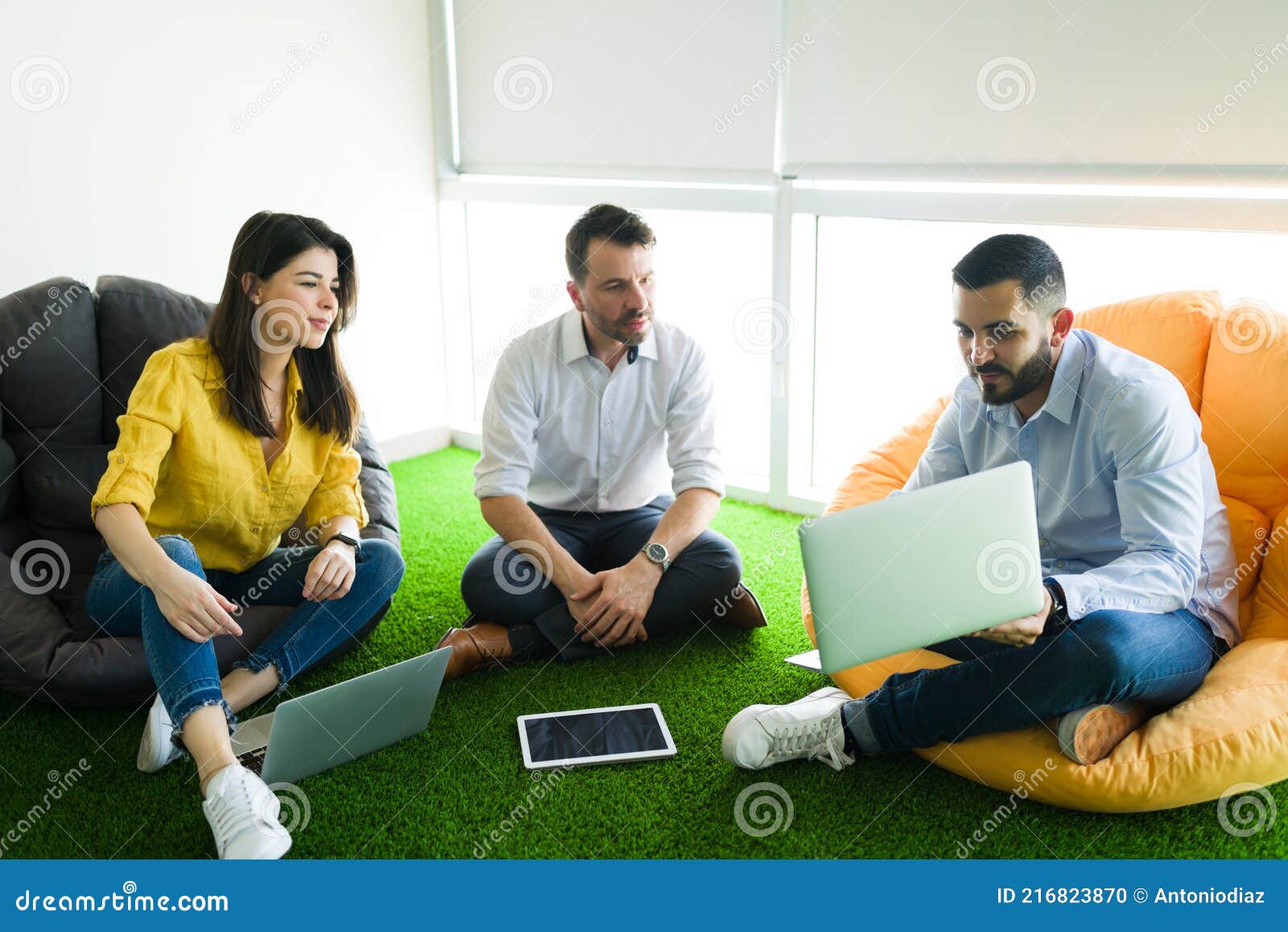 Relaxed Colleagues Doing a Work Project Stock Photo - Image of relaxed ...