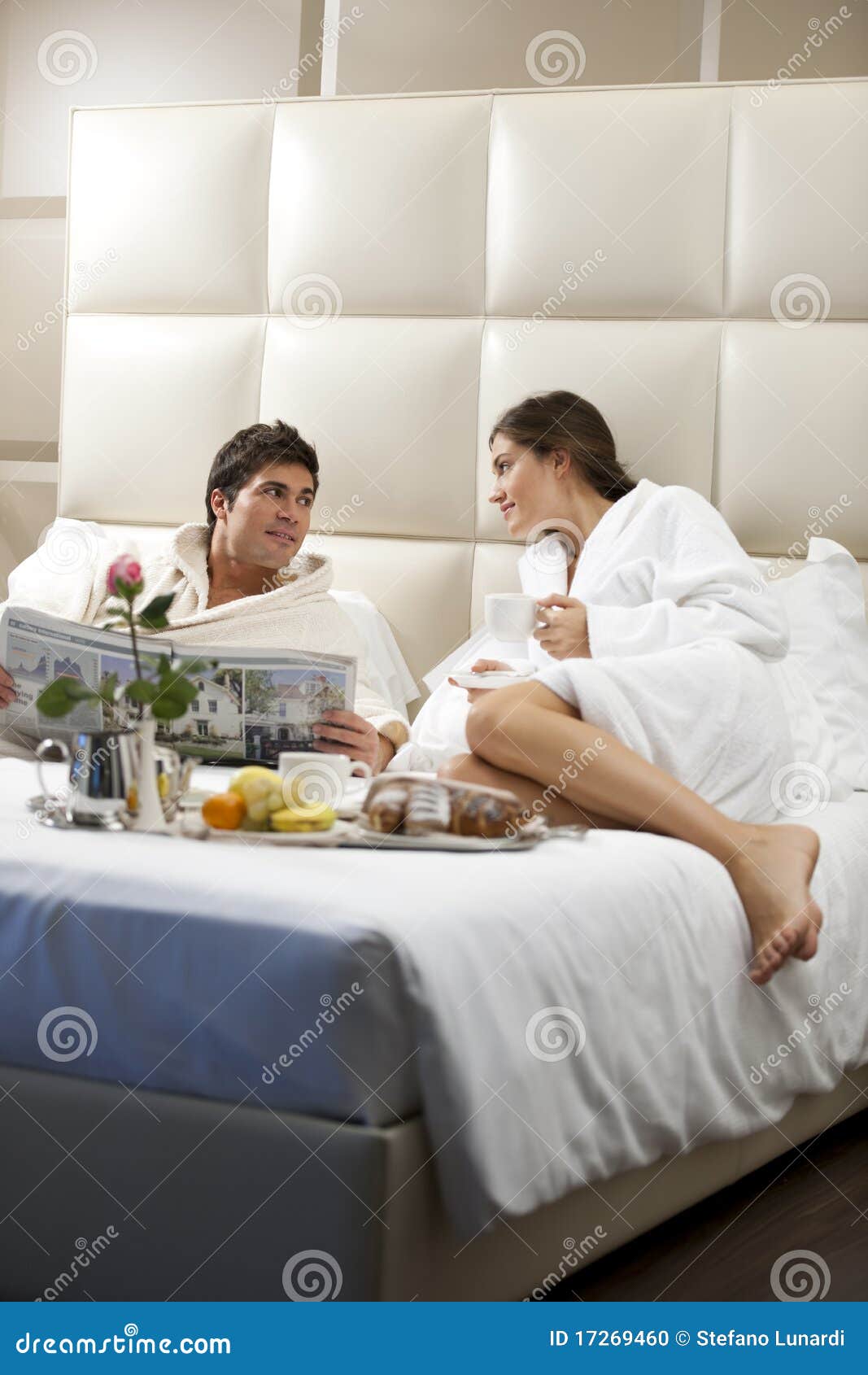 Relaxed Couple in Bed stock photo. Image of female, reading - 17269460
