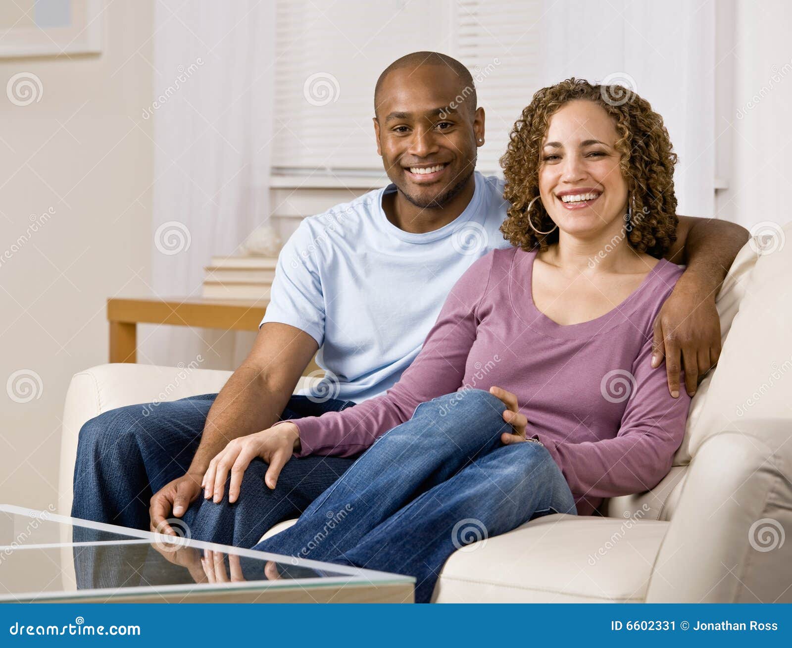 Relaxed Couple Sitting on Sofa in Livingroom Stock Image - Image of ...