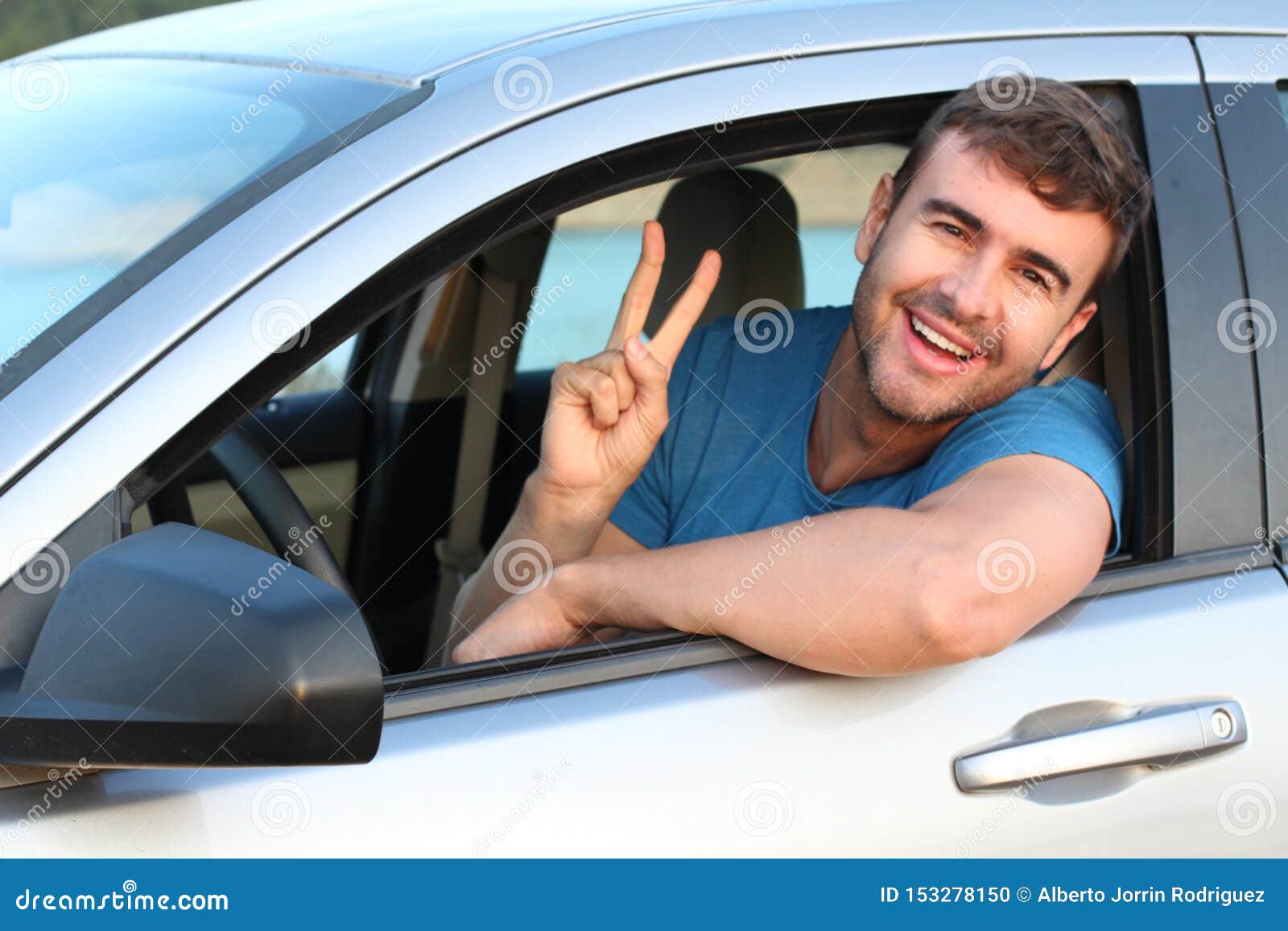 Relaxed Driver Showing Peace Sign Stock Photo - Image of farewell, cute ...