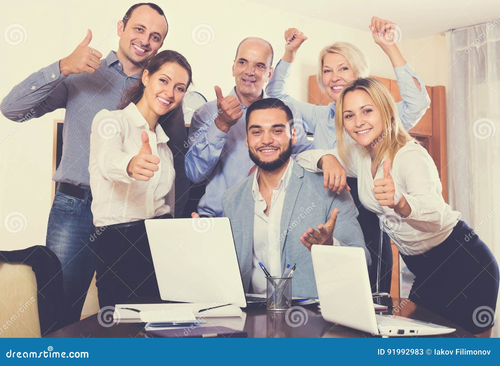 Relaxed Employees Sitting at Desk Stock Image - Image of rest, success ...