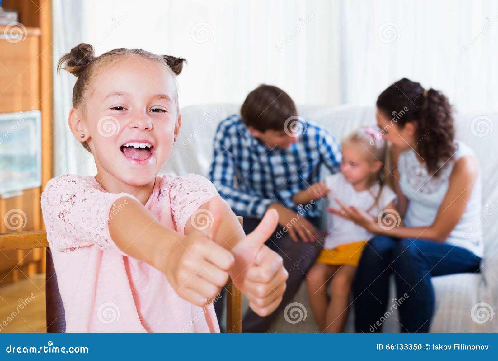 Relaxed Family of Four Posing Stock Photo - Image of freetime, indoors ...