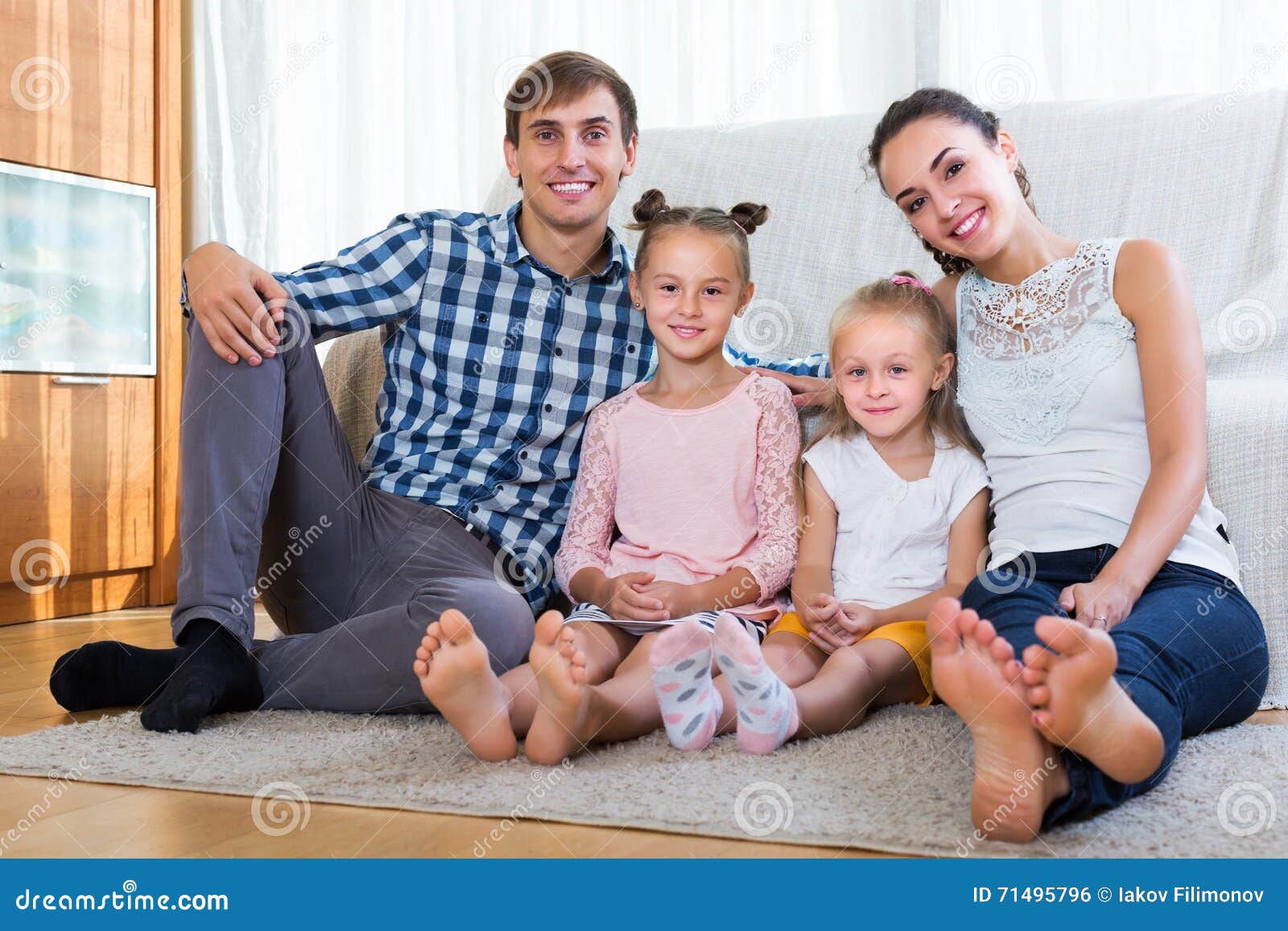 Relaxed Family of Four Posing Stock Photo - Image of clothing, european ...