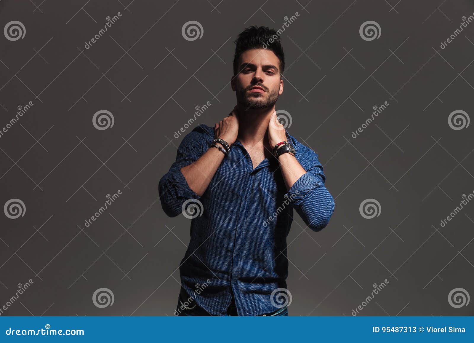 Relaxed Fashion Man Holding Both Hands on Neck Stock Image - Image of ...
