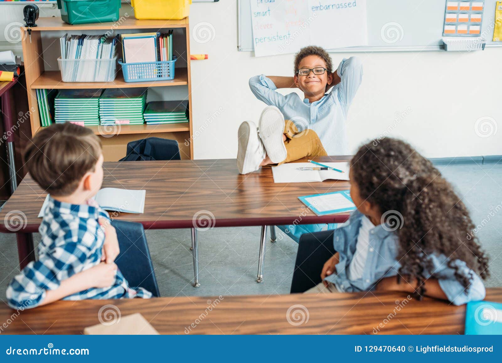Relaxed kids in class stock photo. Image of black, discovery - 129470640