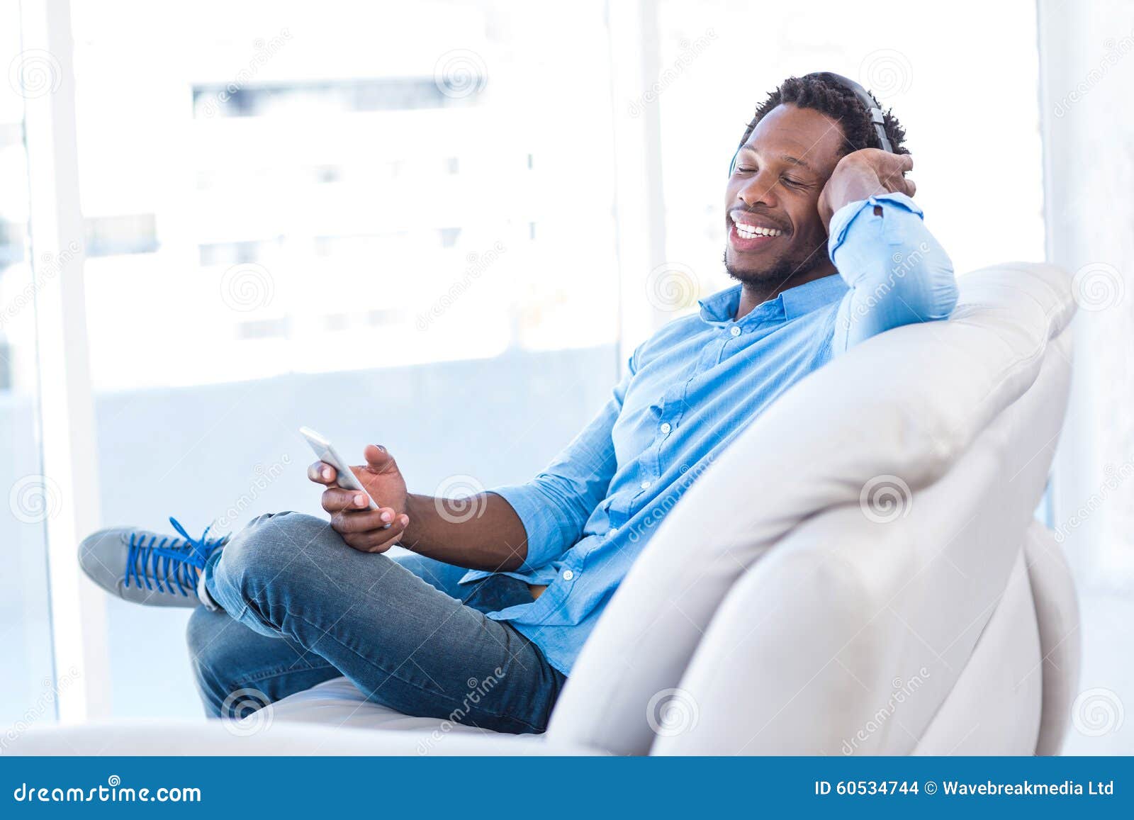 Relaxed man enjoying music stock photo. Image of focus - 60534744