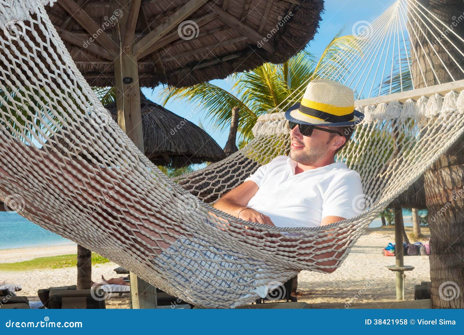 Relaxed Man in a Hammock on the Beach Stock Photo - Image of ocean ...