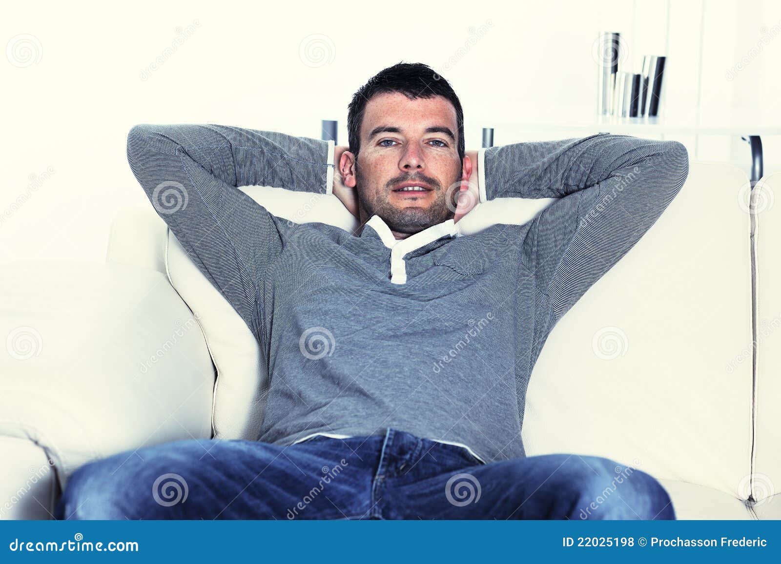 Relaxed man on his sofa stock photo. Image of people - 22025198