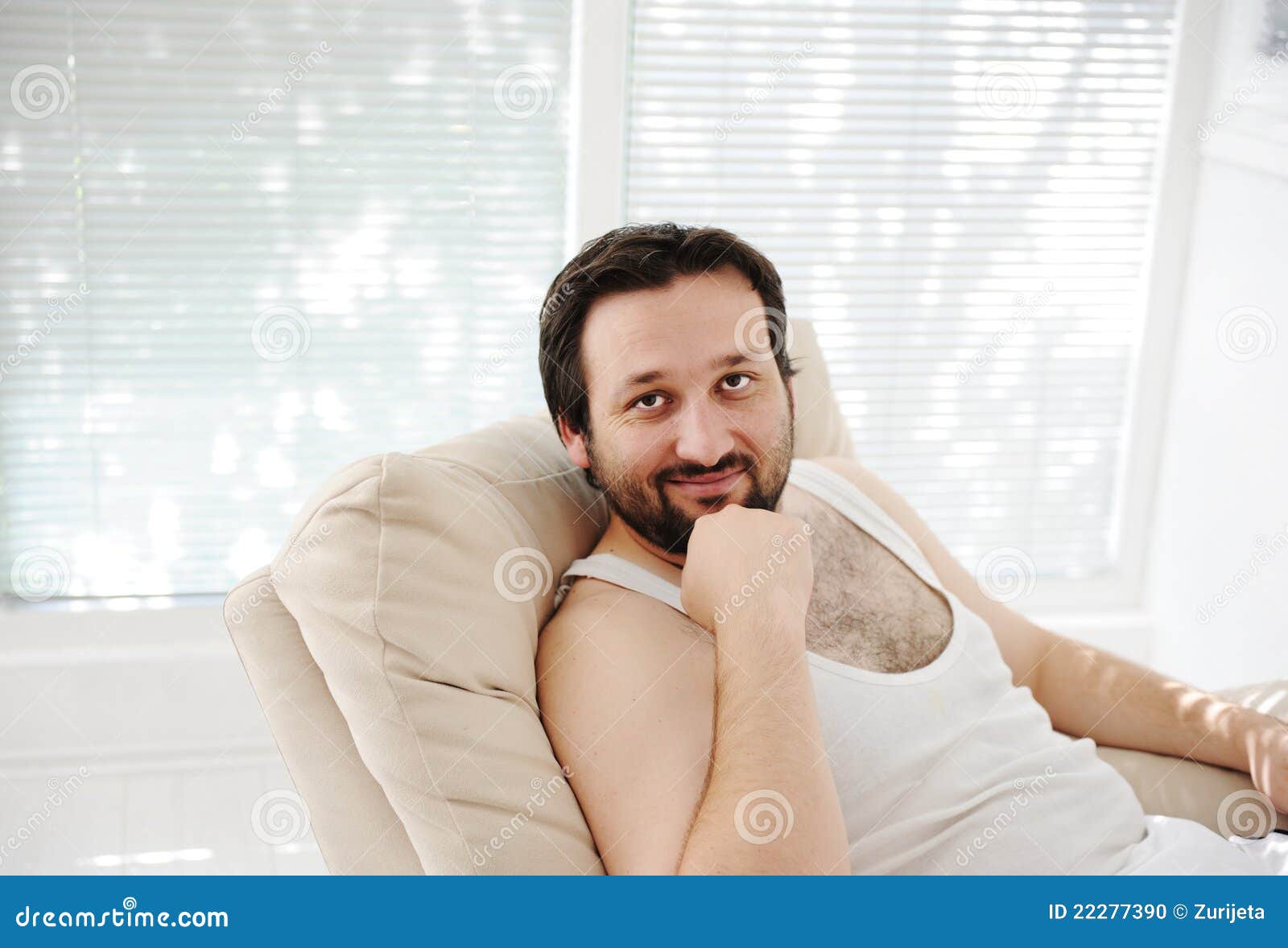 Relaxed man at home stock photo. Image of sitting, portrait - 22277390