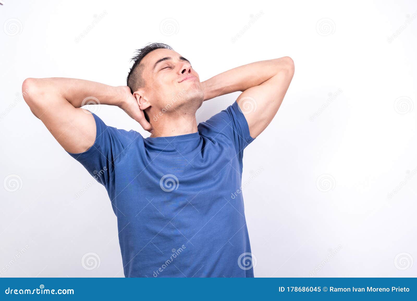 Relaxed Man Leaning Back with His Hands on the Back of His Neck Stock ...