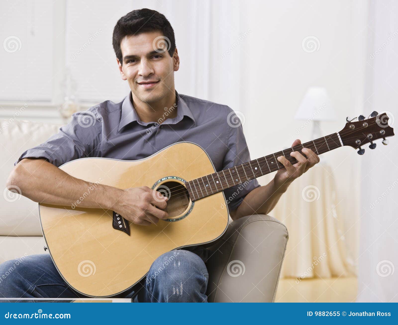 Relaxed Man Playing Guitar stock image. Image of peaceful - 9882655