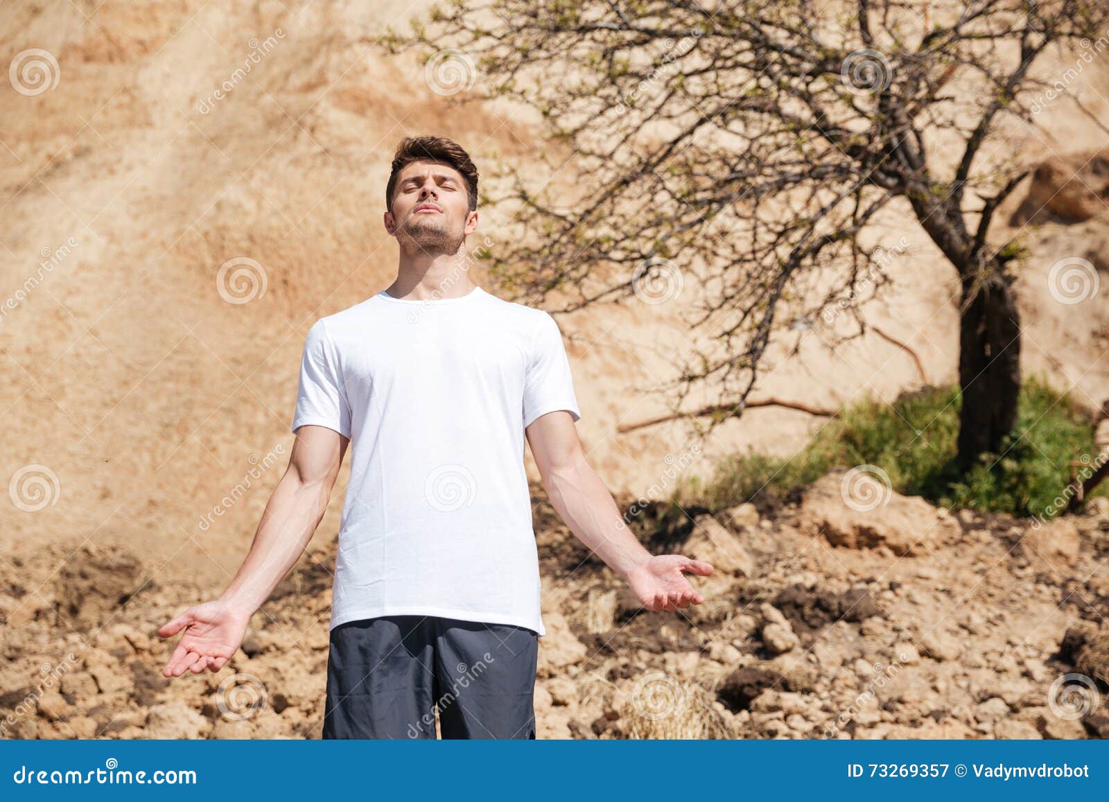 Relaxed Man Standing and Meditating Outdoors Stock Image - Image of ...