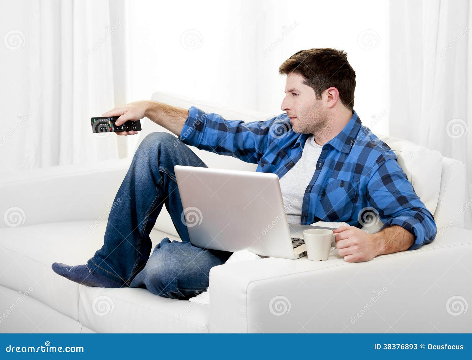 Relaxed Man Using Computer at Home Switching Tv on Stock Image - Image ...
