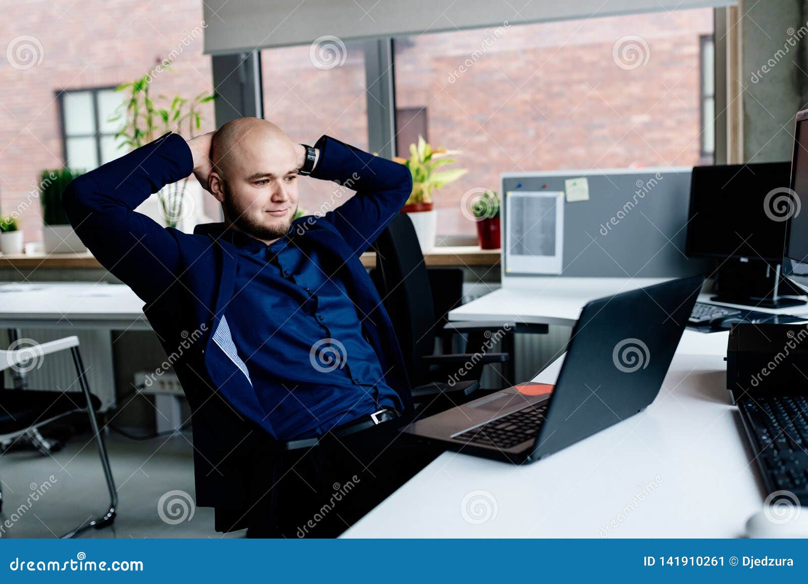 Relaxed Man Working in Office on Laptop Computer Stock Image - Image of ...