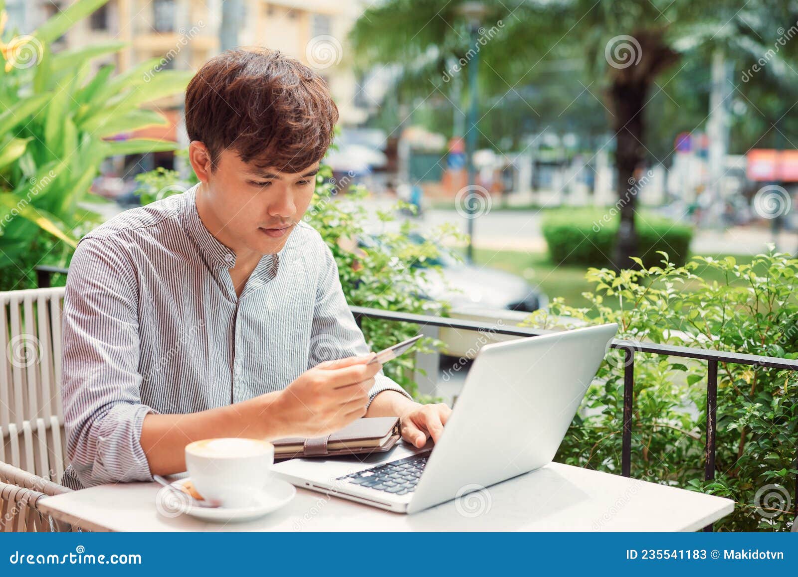 Relaxed Man Writing in a Laptop in a Coffee Shop Stock Image - Image of ...