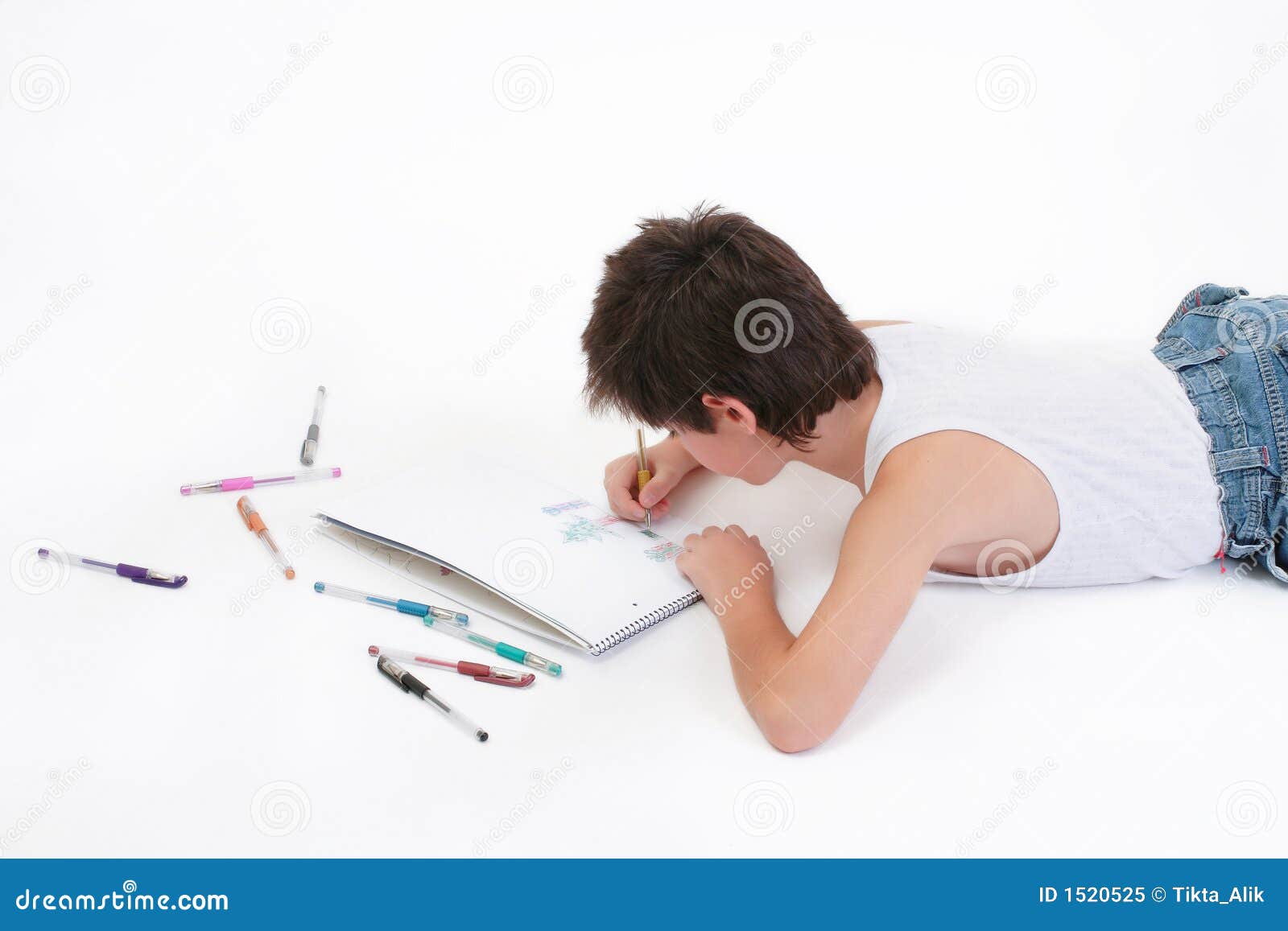 Relaxed schoolboy drawing stock image. Image of child - 1520525