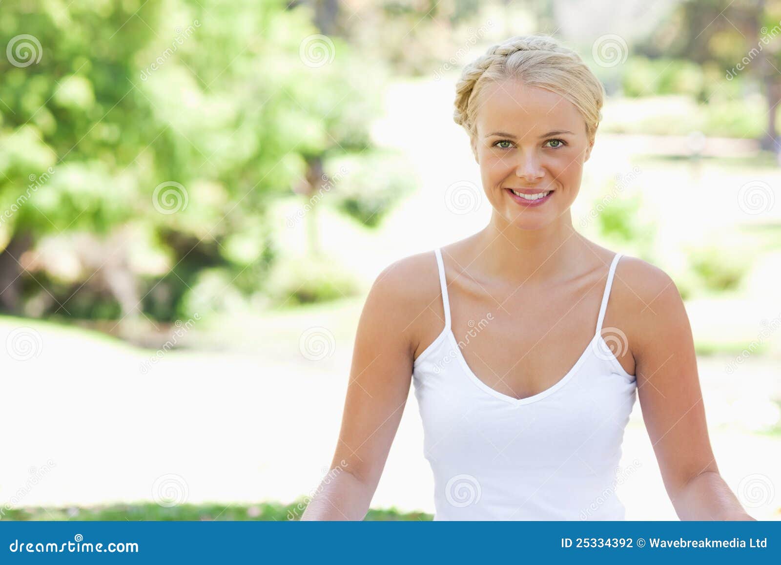 Relaxed Smiling Woman Sitting on the Lawn Stock Photo - Image of forest ...