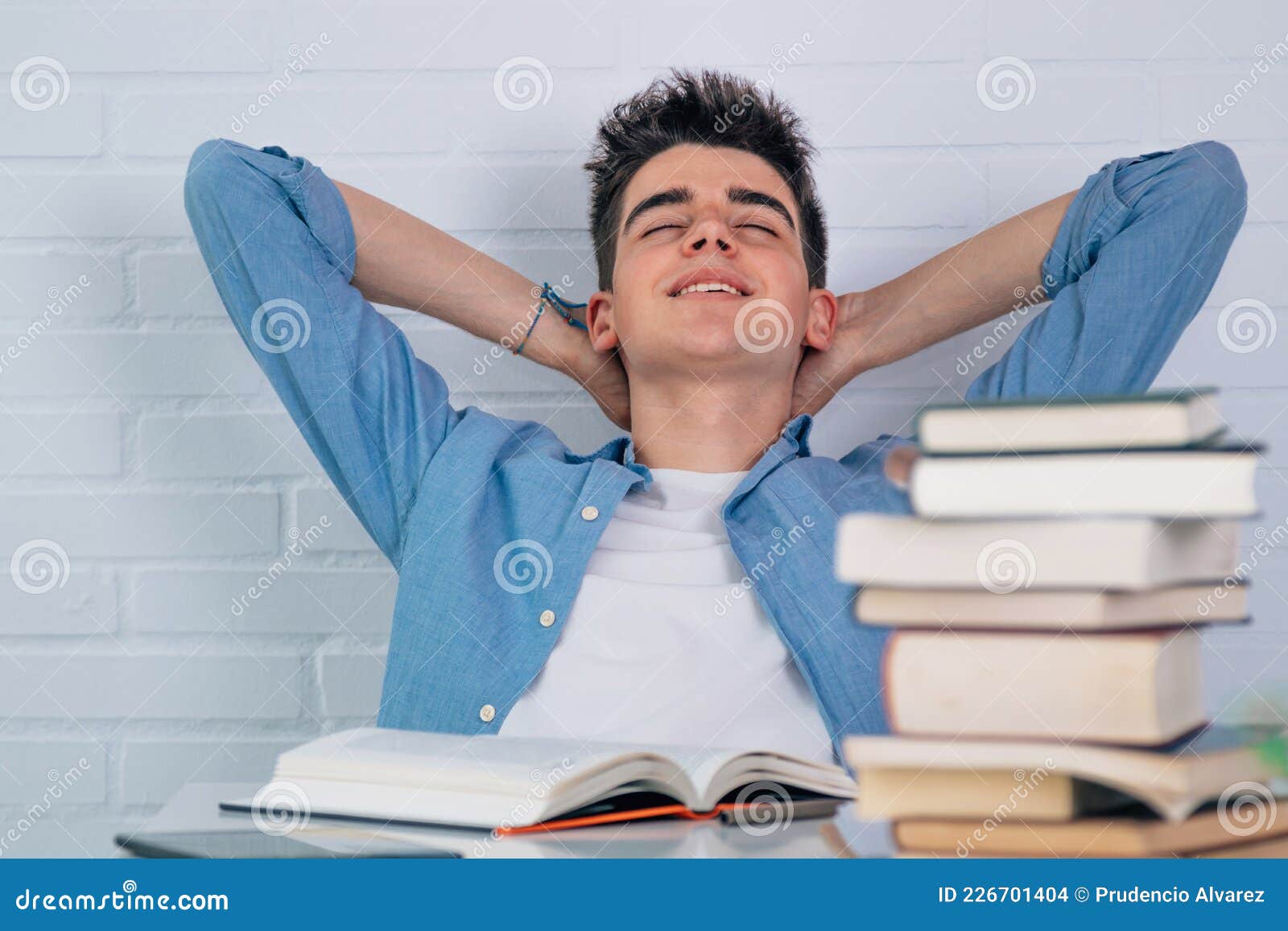 Relaxed Student at the Desk Stock Photo - Image of concepts, relaxed ...