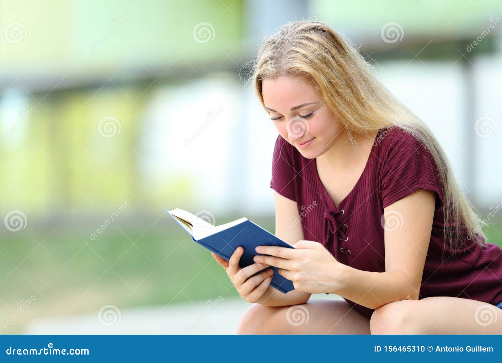 Relaxed Student Studying Reading a Book Outdoors Stock Photo - Image of ...