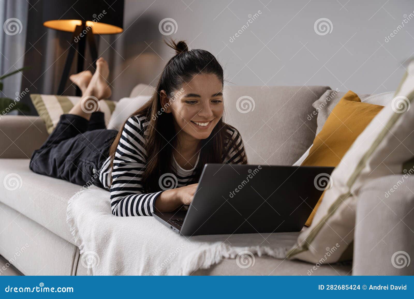 Relaxed Study. Attractive Student Lying on Sofa Bed Cheerfully Working ...