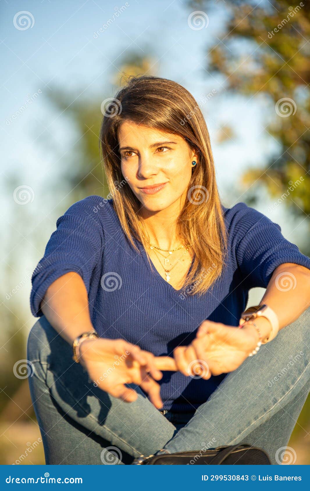 Relaxed Woman Sitting Outdoors in a Park during Sunset Stock Image ...