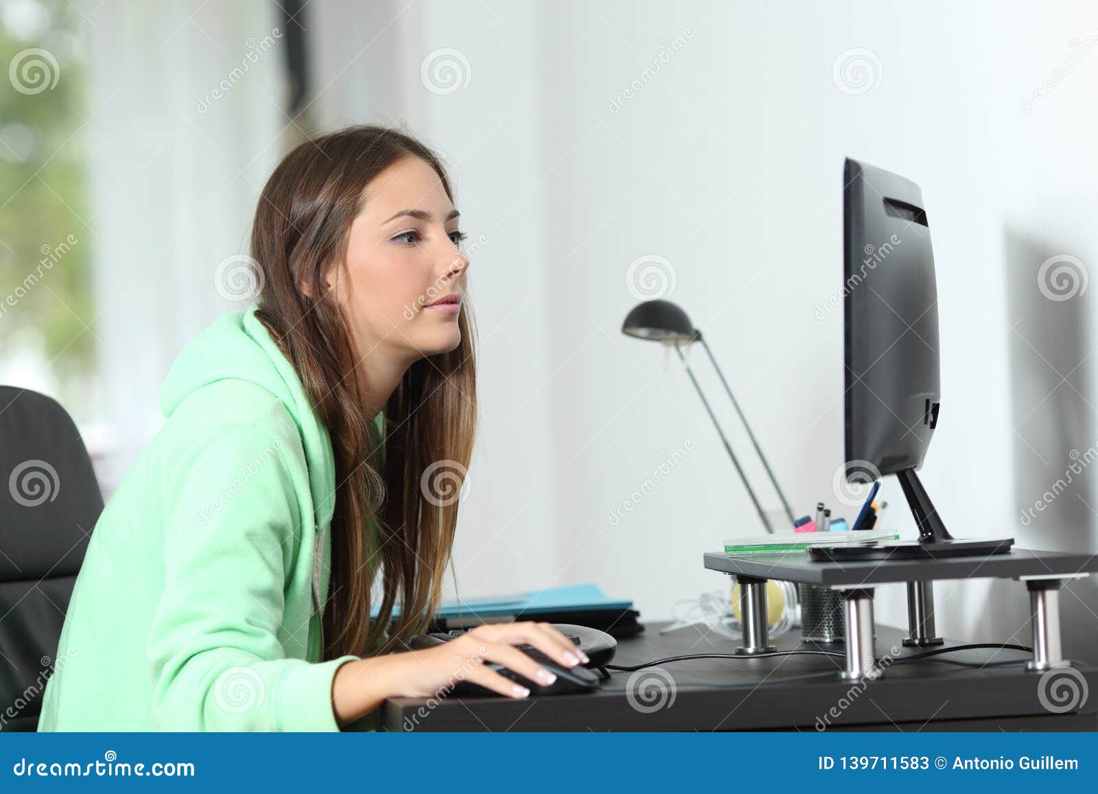 Relaxed Woman Using a Desktop Computer at Home Stock Image - Image of ...