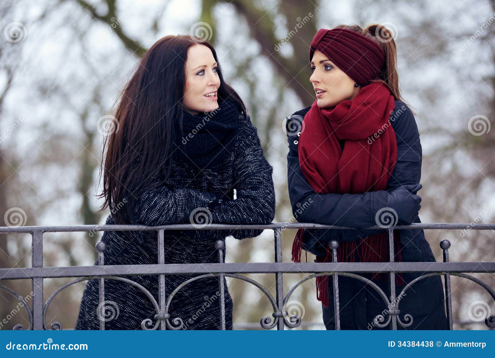 Relaxed Women in Serious Conversation Outdoors Stock Photo - Image of ...