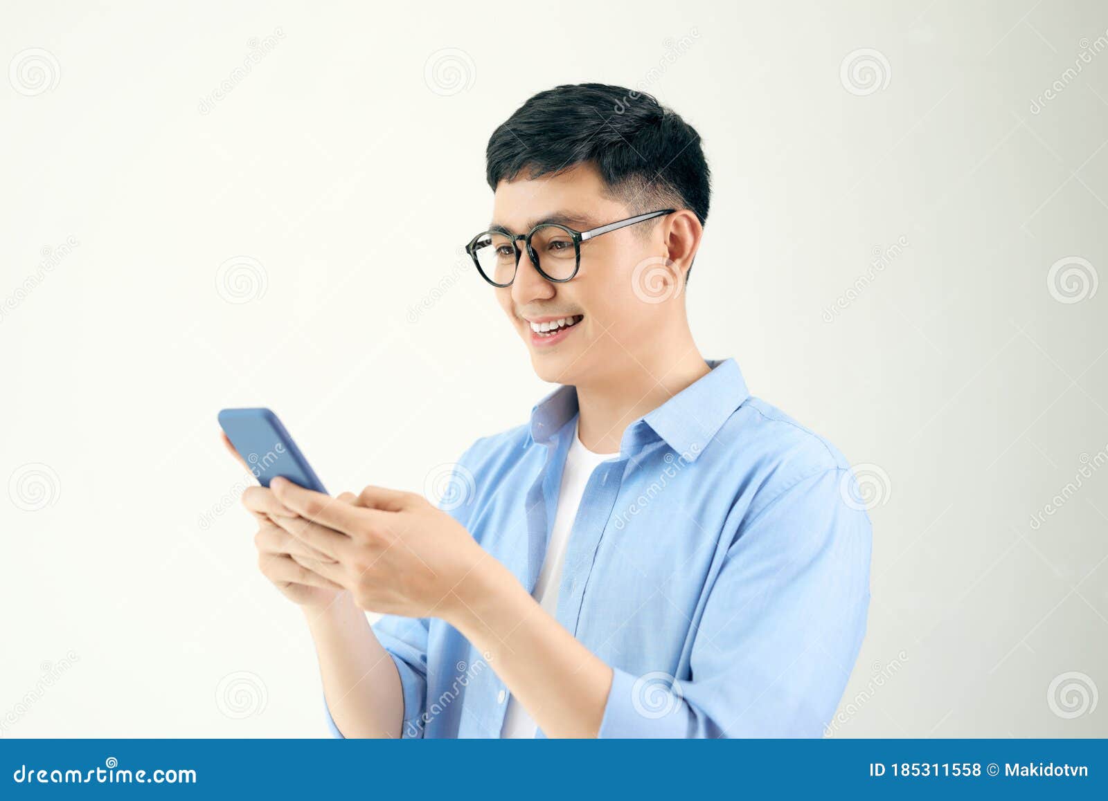 Relaxed Young Casual Man Reading Text Message on Mobile Phone Isolated ...