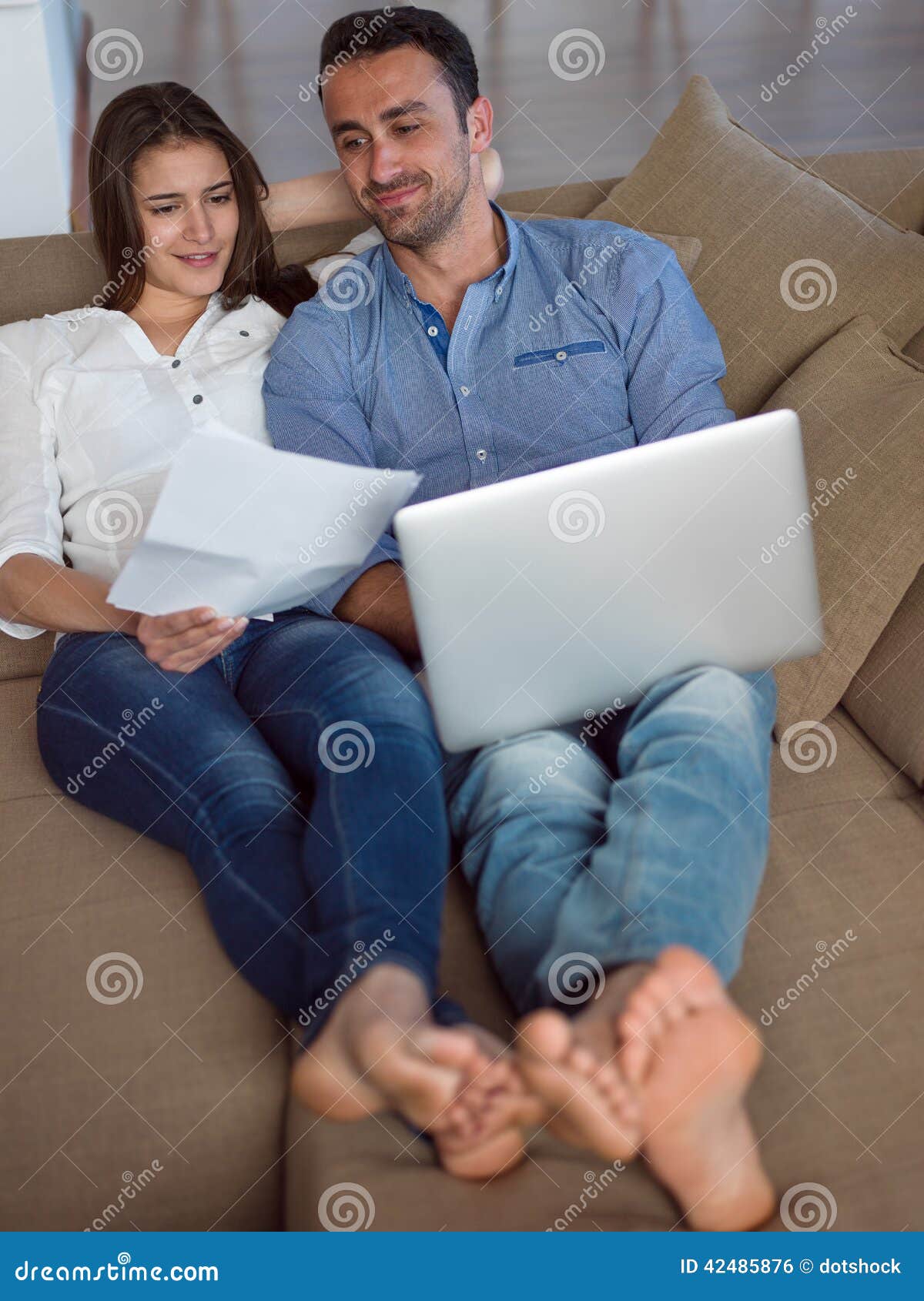 Relaxed Young Couple Working on Laptop Computer at Home Stock Photo ...