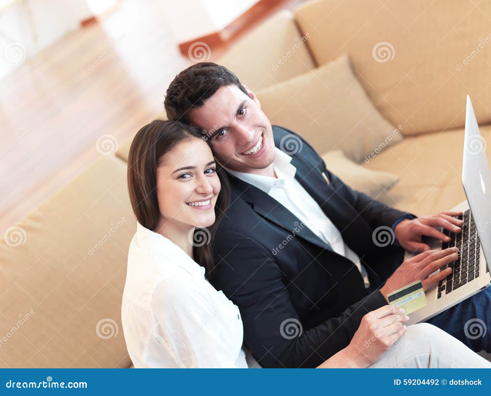 Relaxed Young Couple Working on Laptop Computer at Home Stock Photo ...