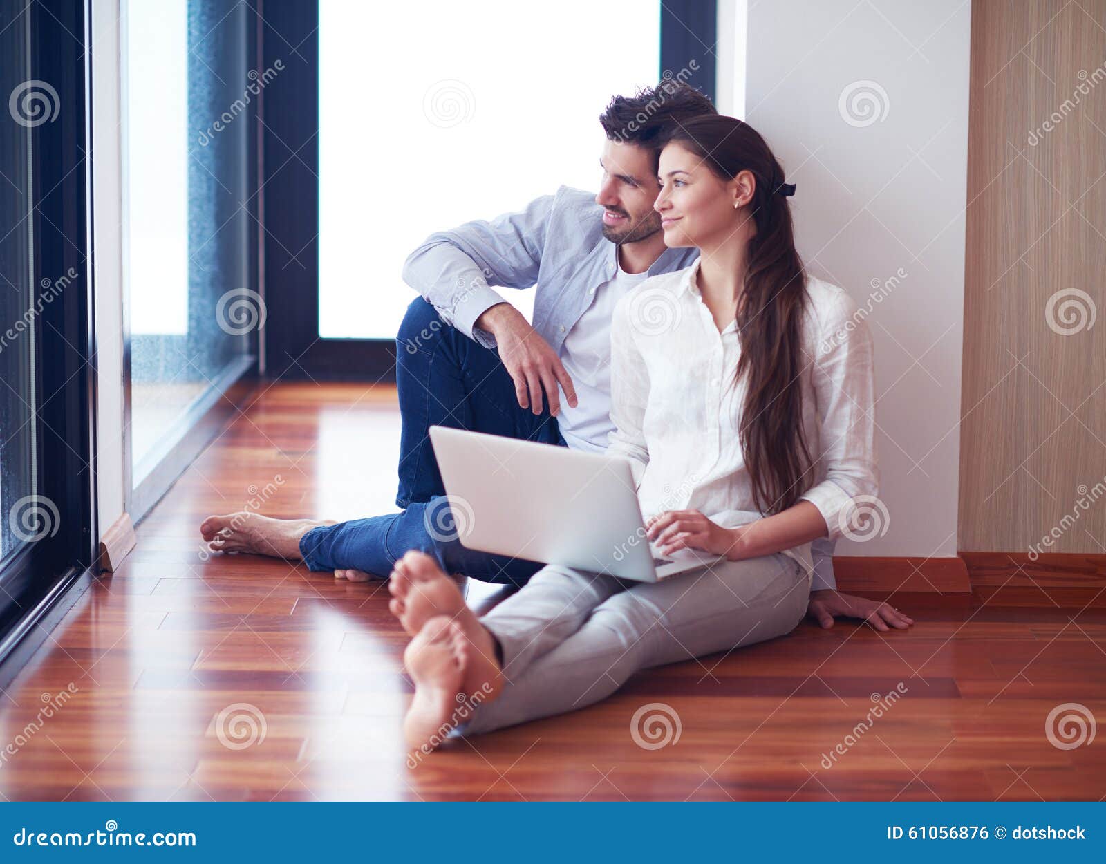 Relaxed Young Couple Working on Laptop Computer at Home Stock Photo ...