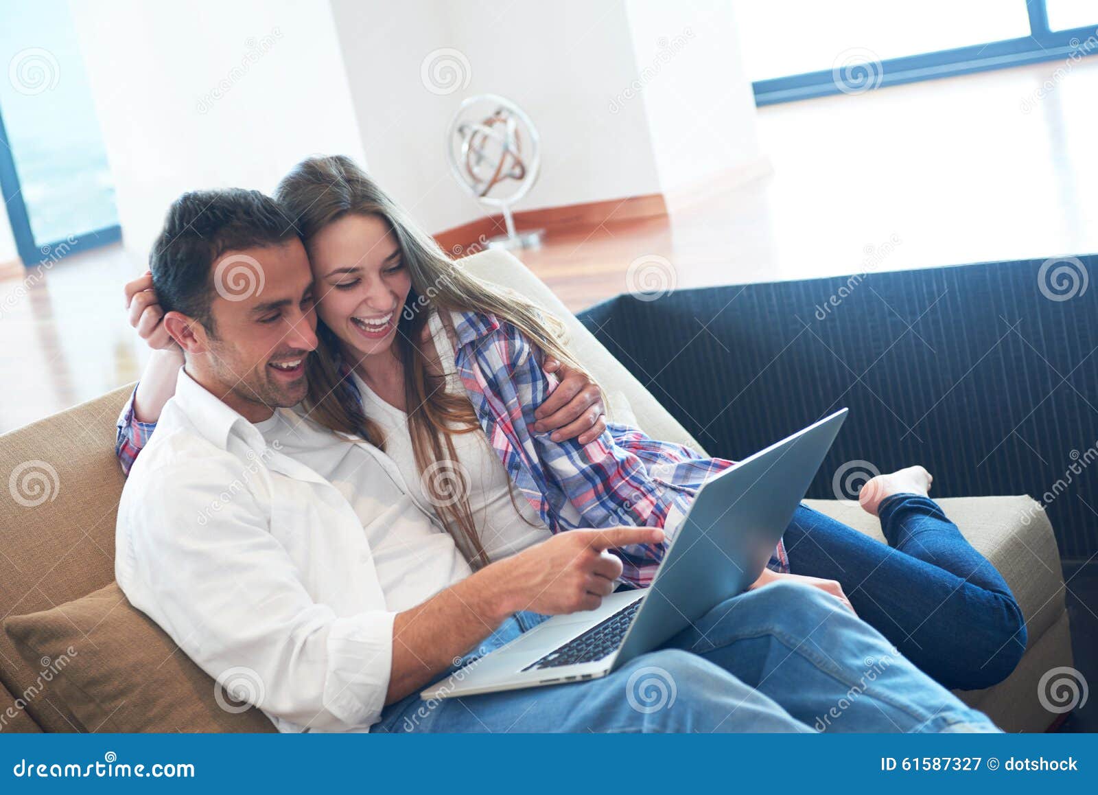 Relaxed Young Couple Working on Laptop Computer at Home Stock Image ...