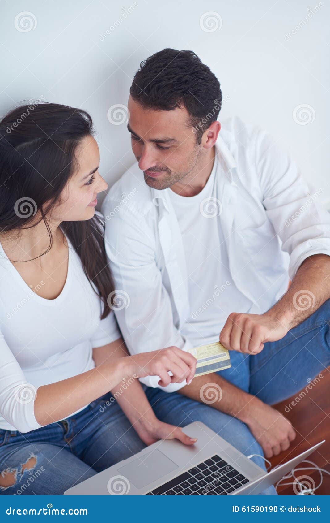 Relaxed Young Couple Working on Laptop Computer at Home Stock Photo ...
