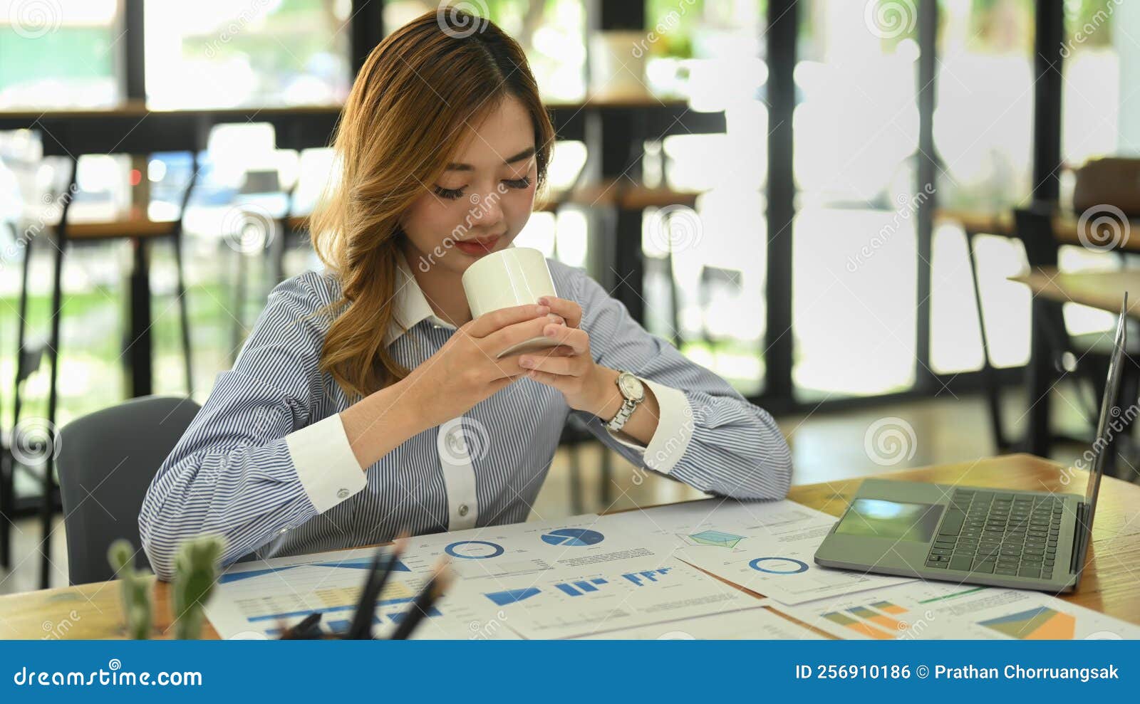 Relaxed Young Employee Resting from Work and Drinking Hot Coffee at Her ...