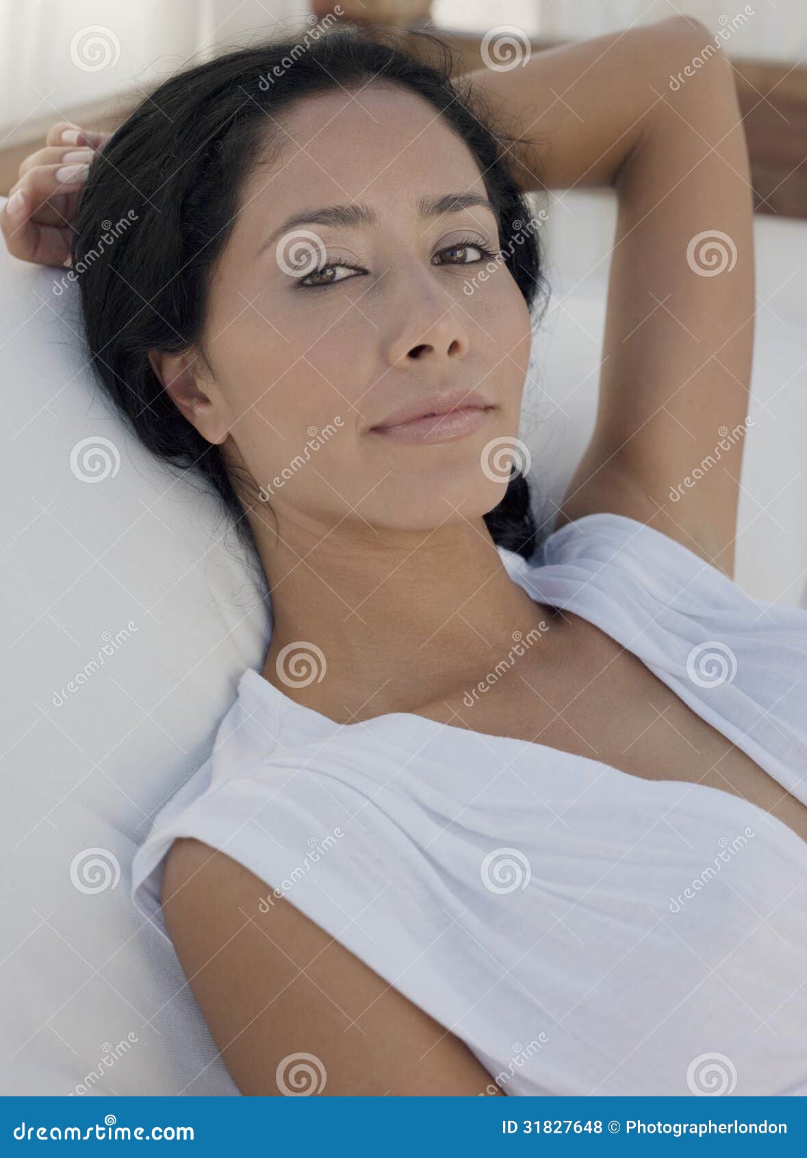 Relaxed Young Woman in Bed stock photo. Image of resting - 31827648