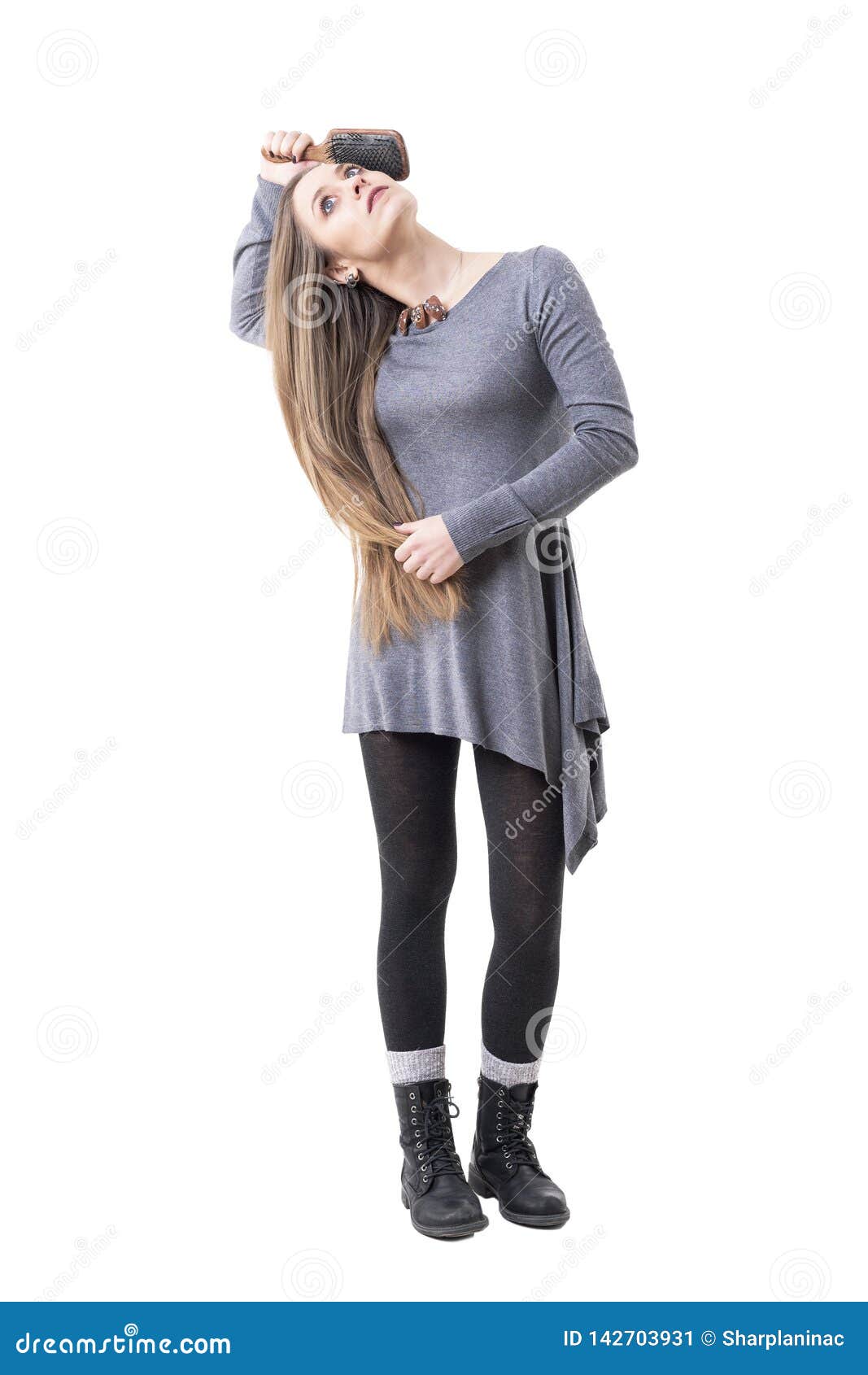 Relaxed Young Woman Doing Daily Routine Brushing Her Long Blonde Smooth