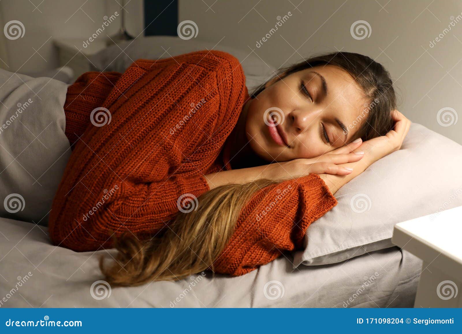 Relaxed Young Woman Sleeping on Bed at Night Stock Photo - Image of ...