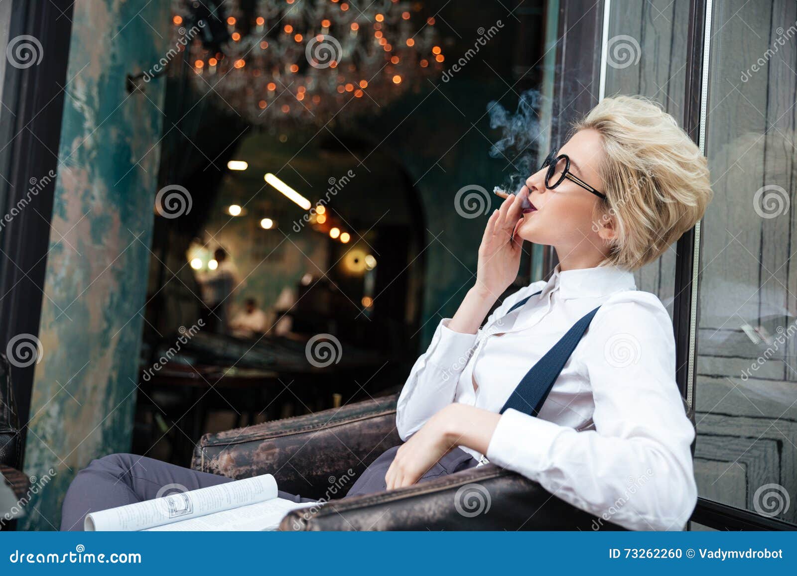 Relaxed Young Woman Smoking Cigarette in Cafe Stock Photo - Image of ...