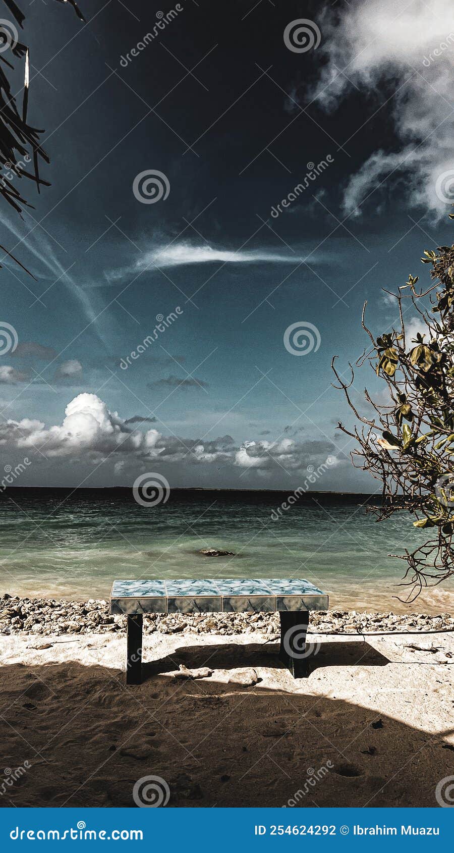 Relaxing beach bench stock photo. Image of clouds, beach - 254624292